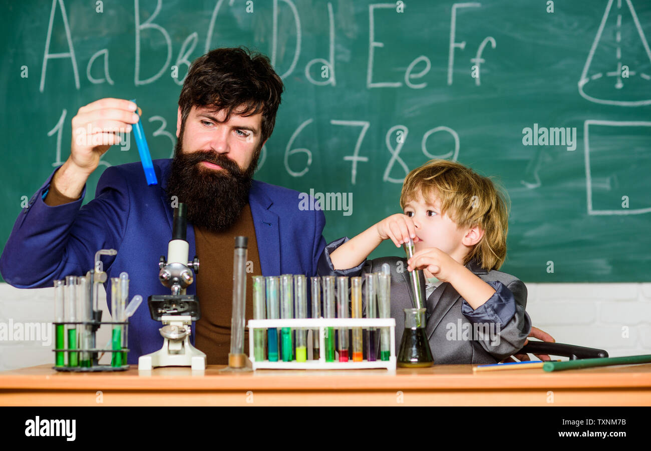 Strength On Your Side. Little kid learning chemistry in school ...