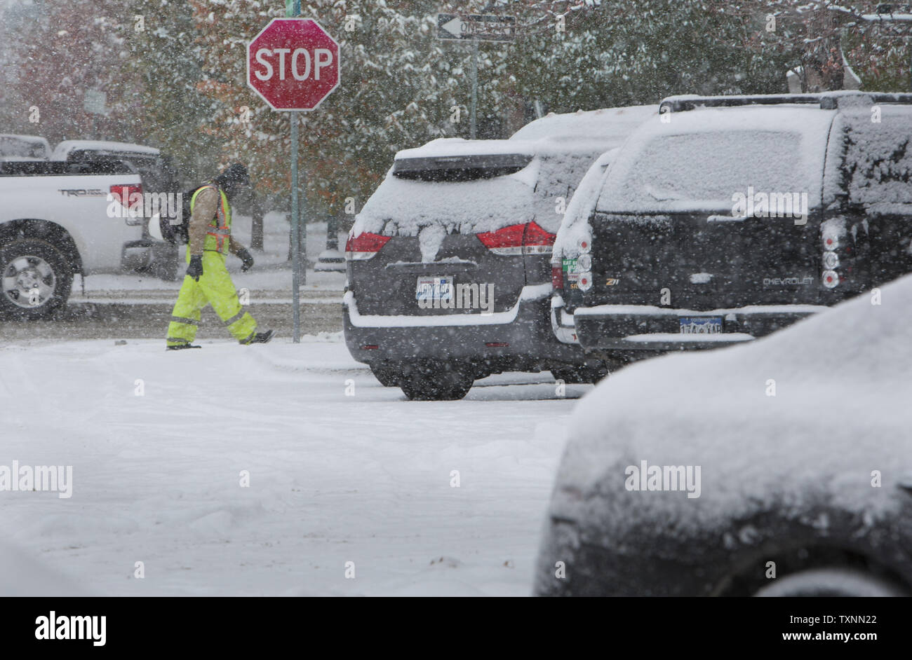 Dressed in highly visible snow suit, a resident walks to work during a ...
