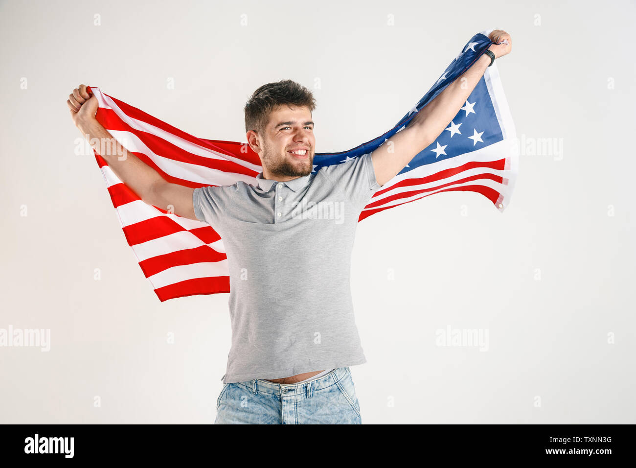 Celebrating an Independence day. Stars and Stripes. Young man with the ...