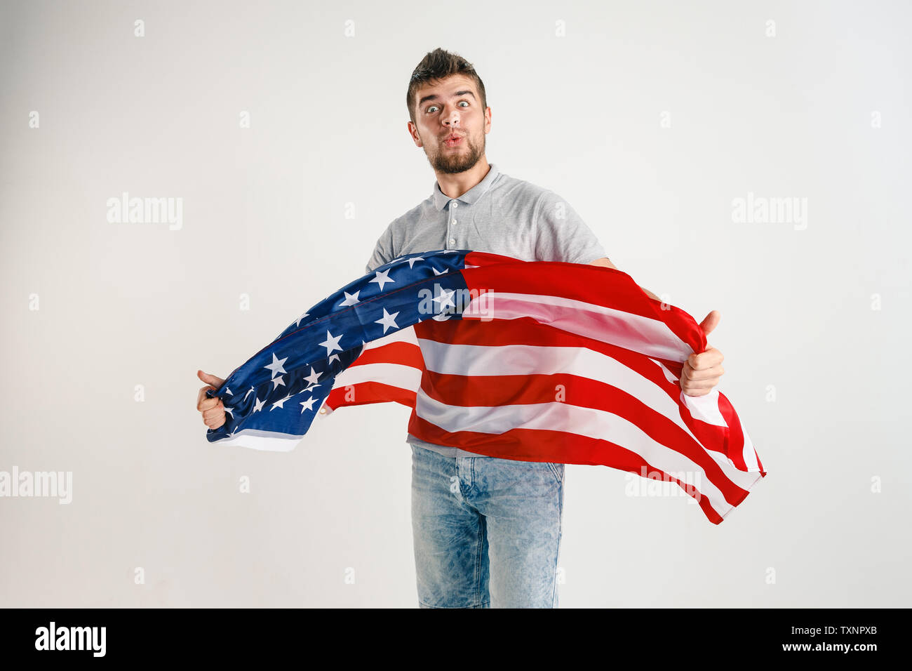 Celebrating an Independence day. Stars and Stripes. Young man with the ...