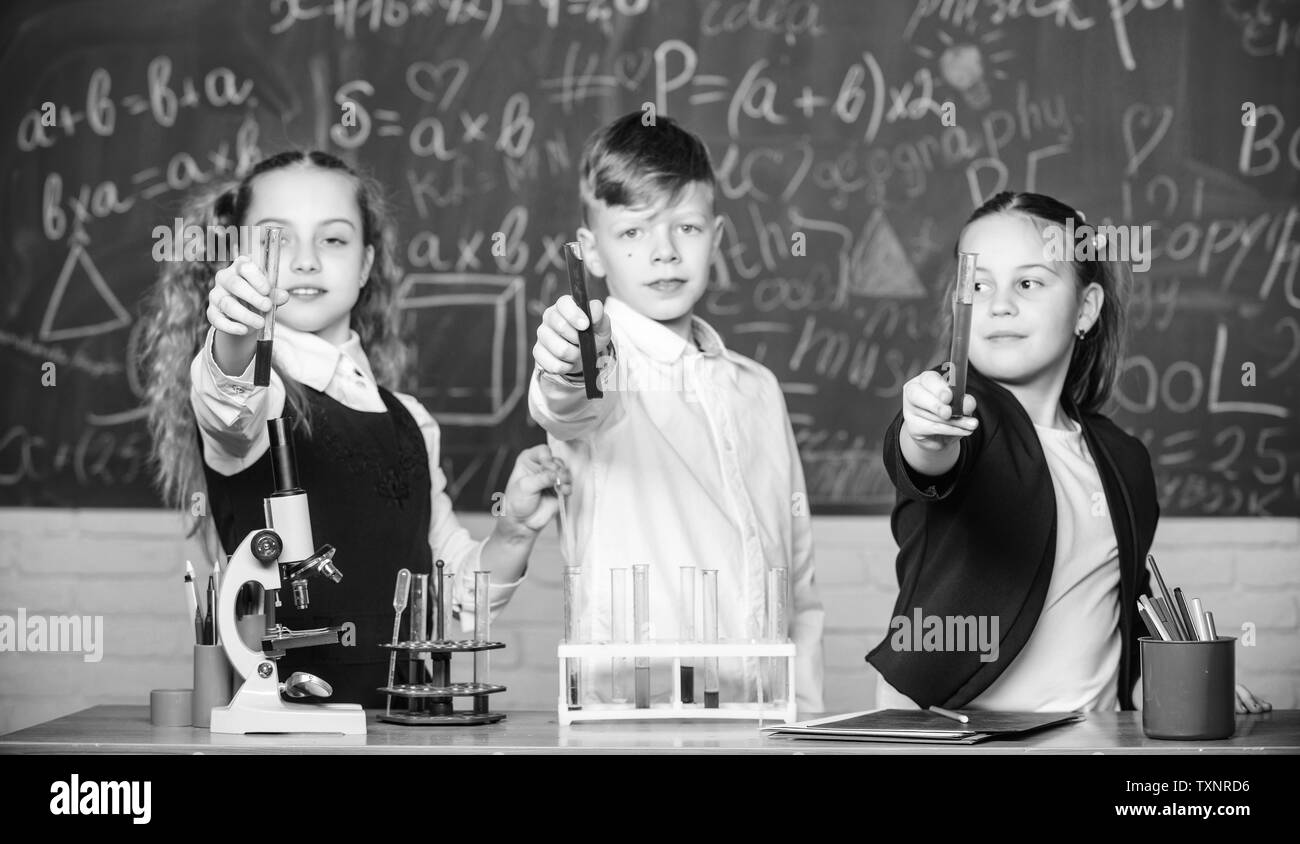 For a better tomorrow. Lab microscope and testing tubes. Chemistry ...