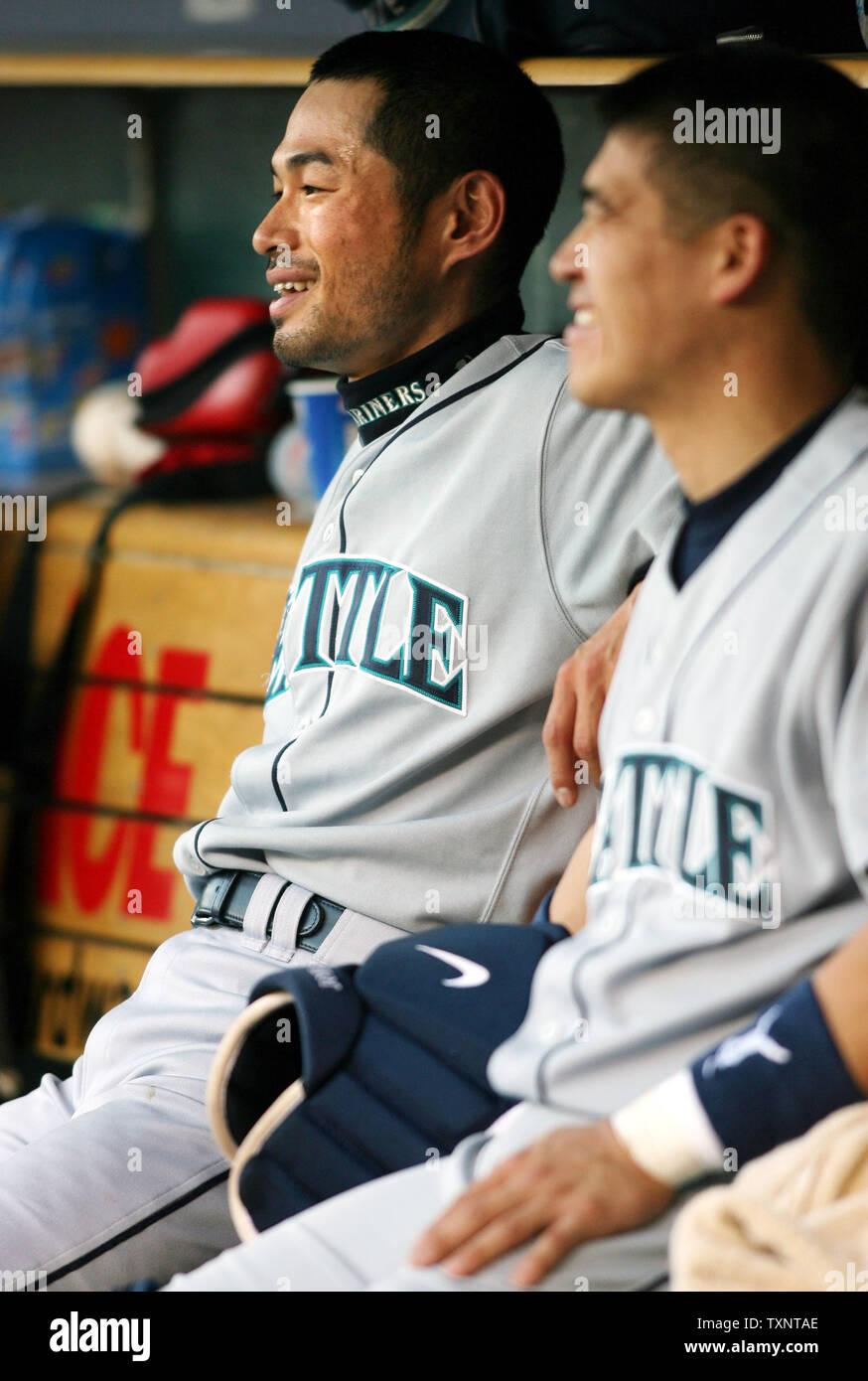 Seattle Mariners' Ichiro Suzuki, left, laughs with catcher Kenji ...