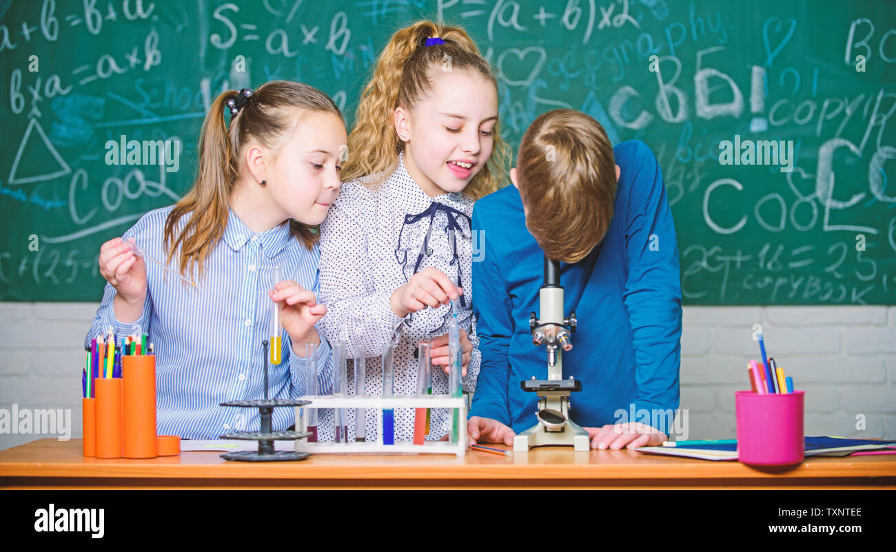 Chemistry science. Little kids earning chemistry in school lab. biology ...