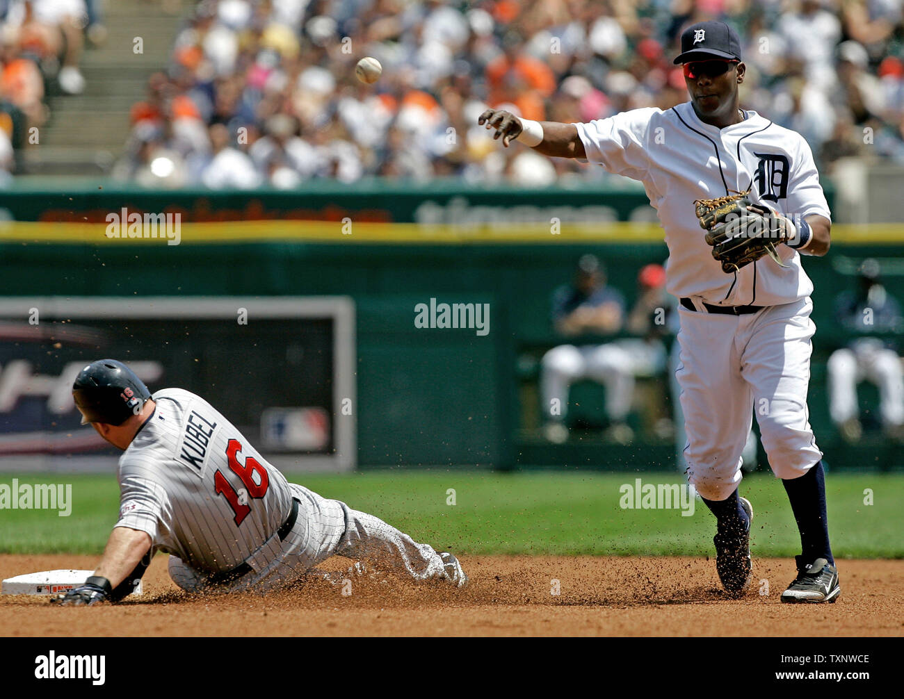 Minnesota Twins' Jason Kubel (16) slides into second as Detroit Tigers ...