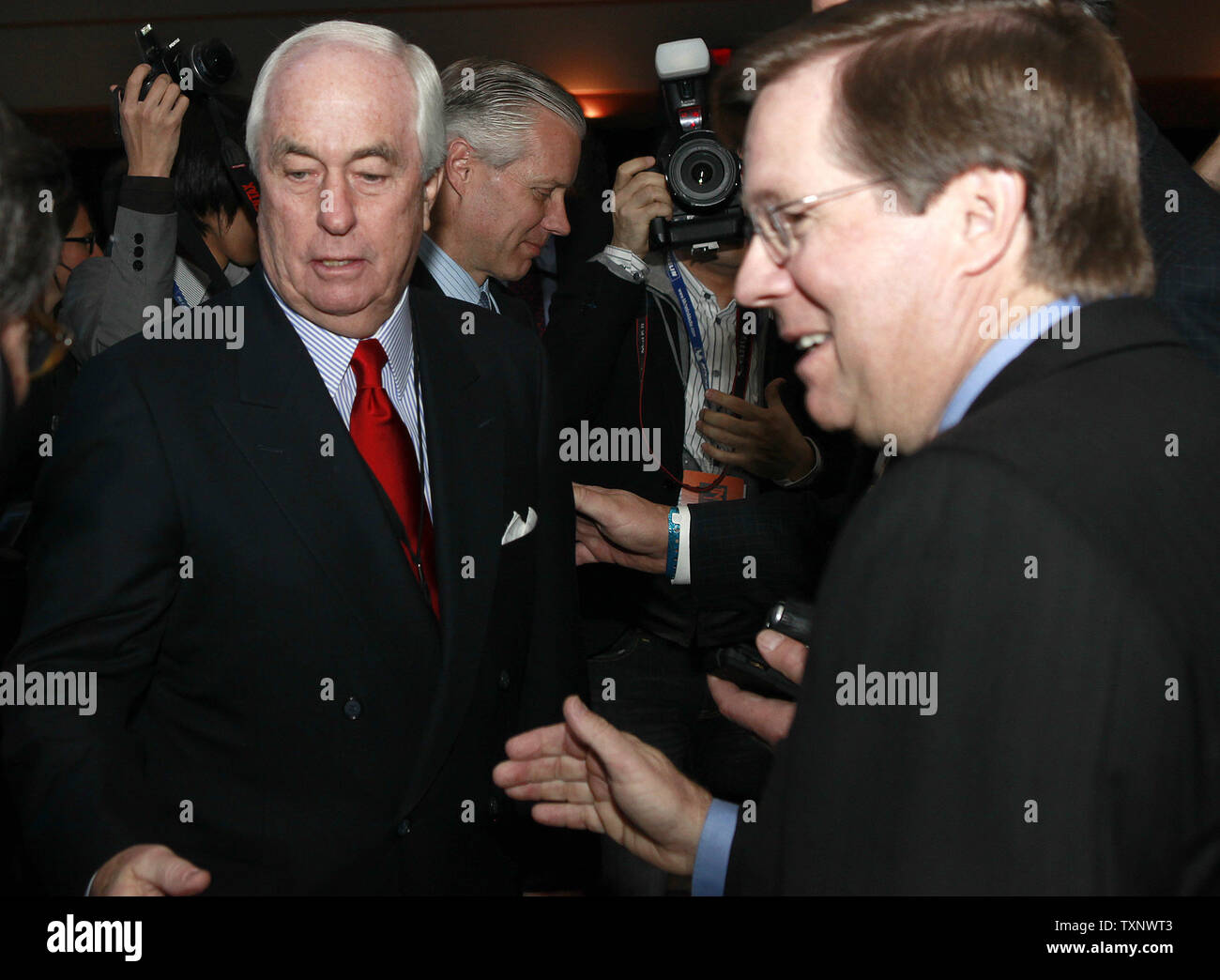 Roger Penske, left, speaks with Jim Lentz, president of Toyota Motor ...