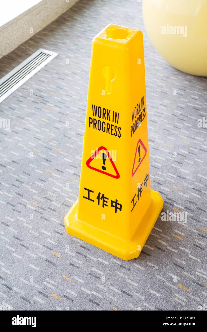 Yellow cone,work in progress signs Stock Photo - Alamy