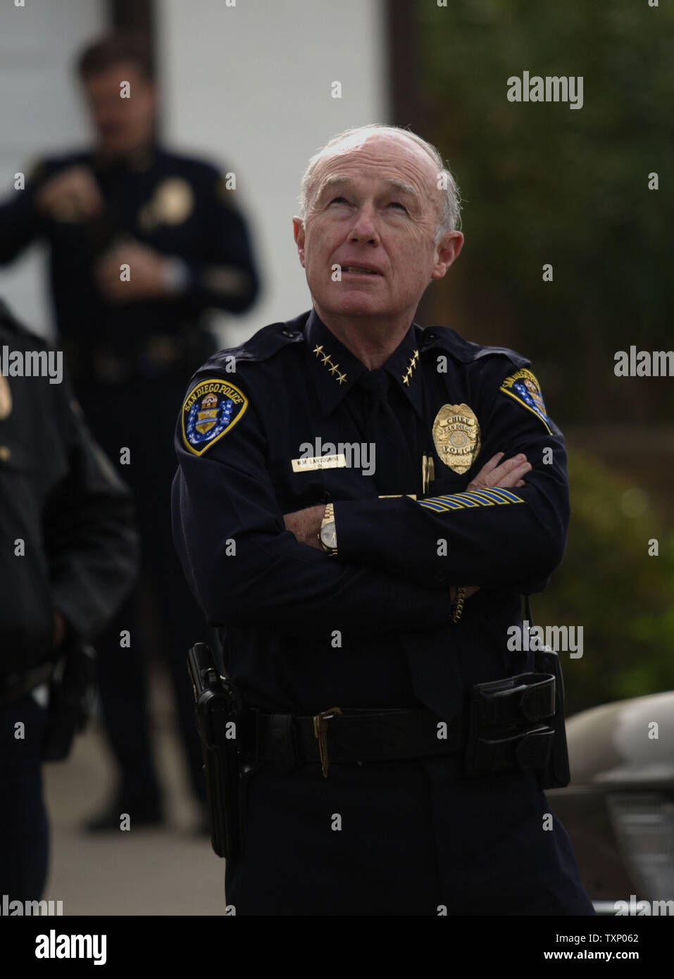 San Diego Police Chief William Lansdowne looks to the sky while a ...
