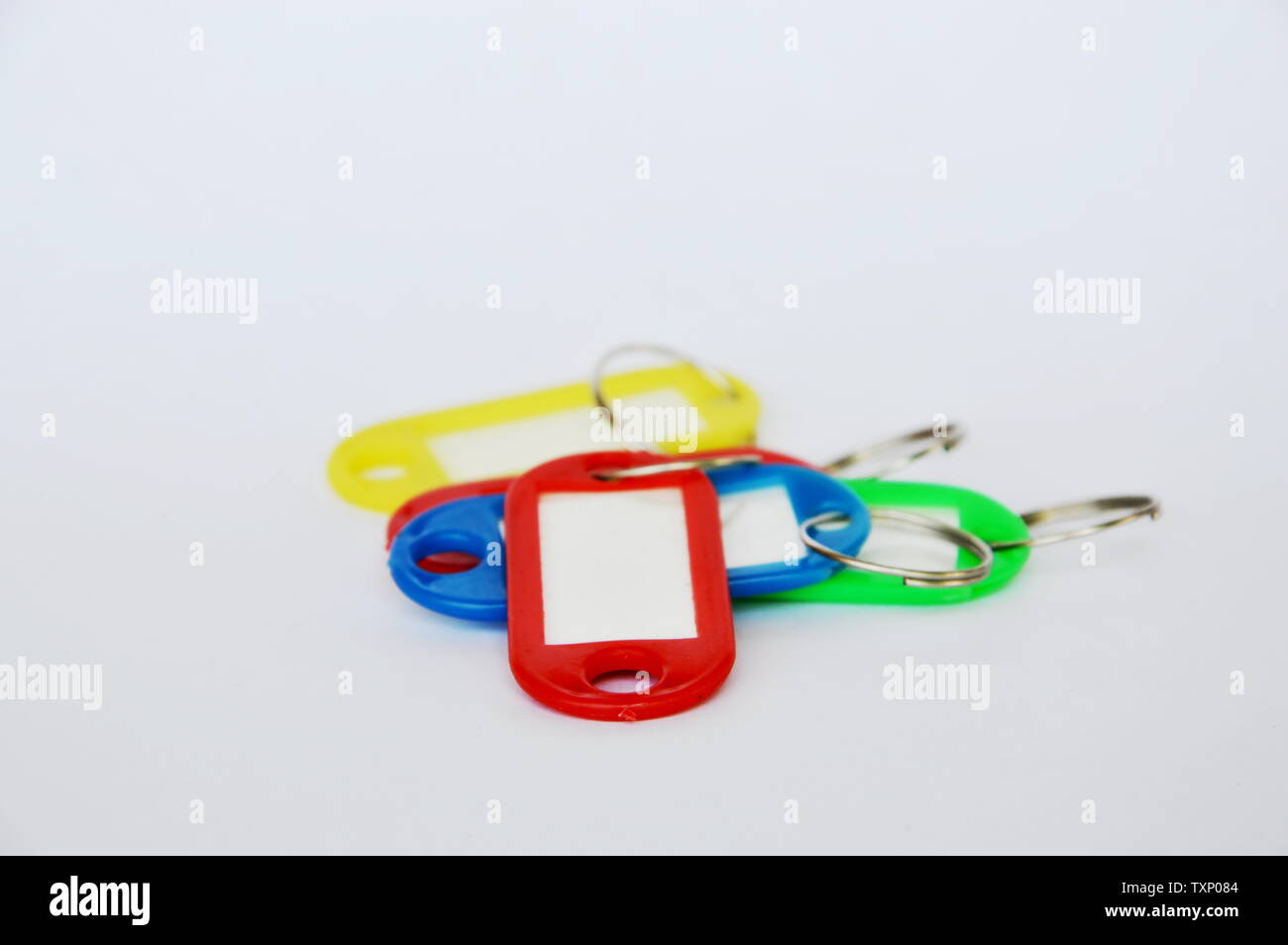 colorful plastic name tag on white background Stock Photo - Alamy