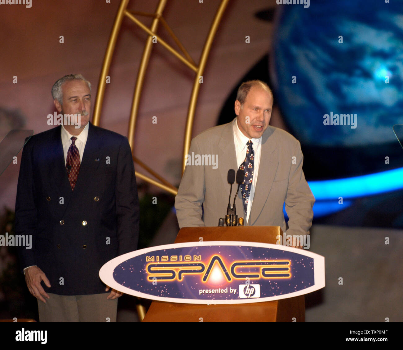 Michael Eisner, CEO of the Walt Disney Company (right) addresses the ...