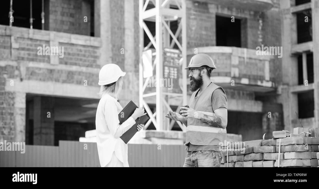 Construction team communication concept. Woman engineer and brutal ...