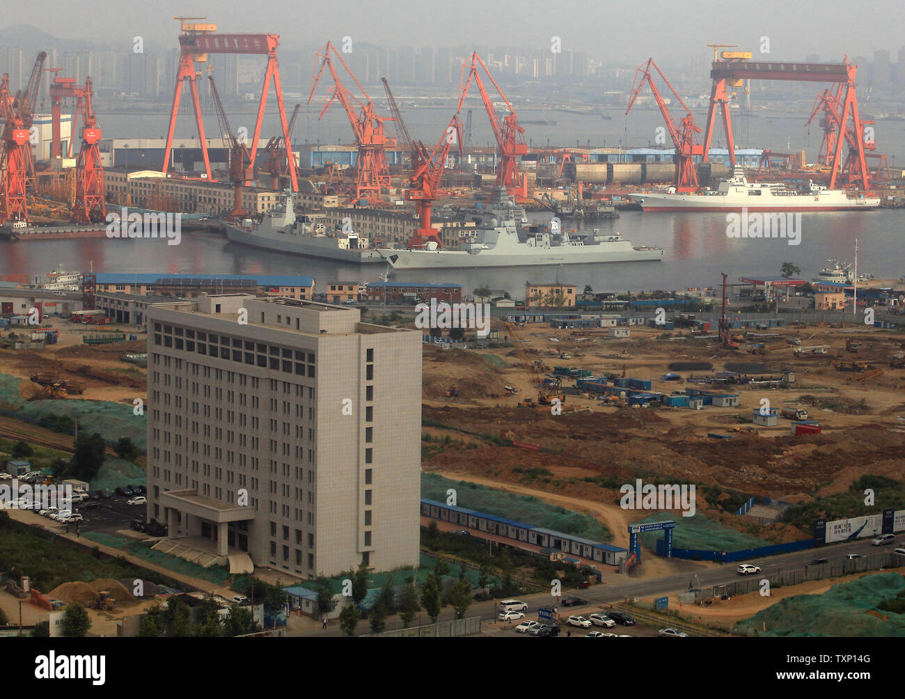 Chinese naval ships going through various stages of construction and ...