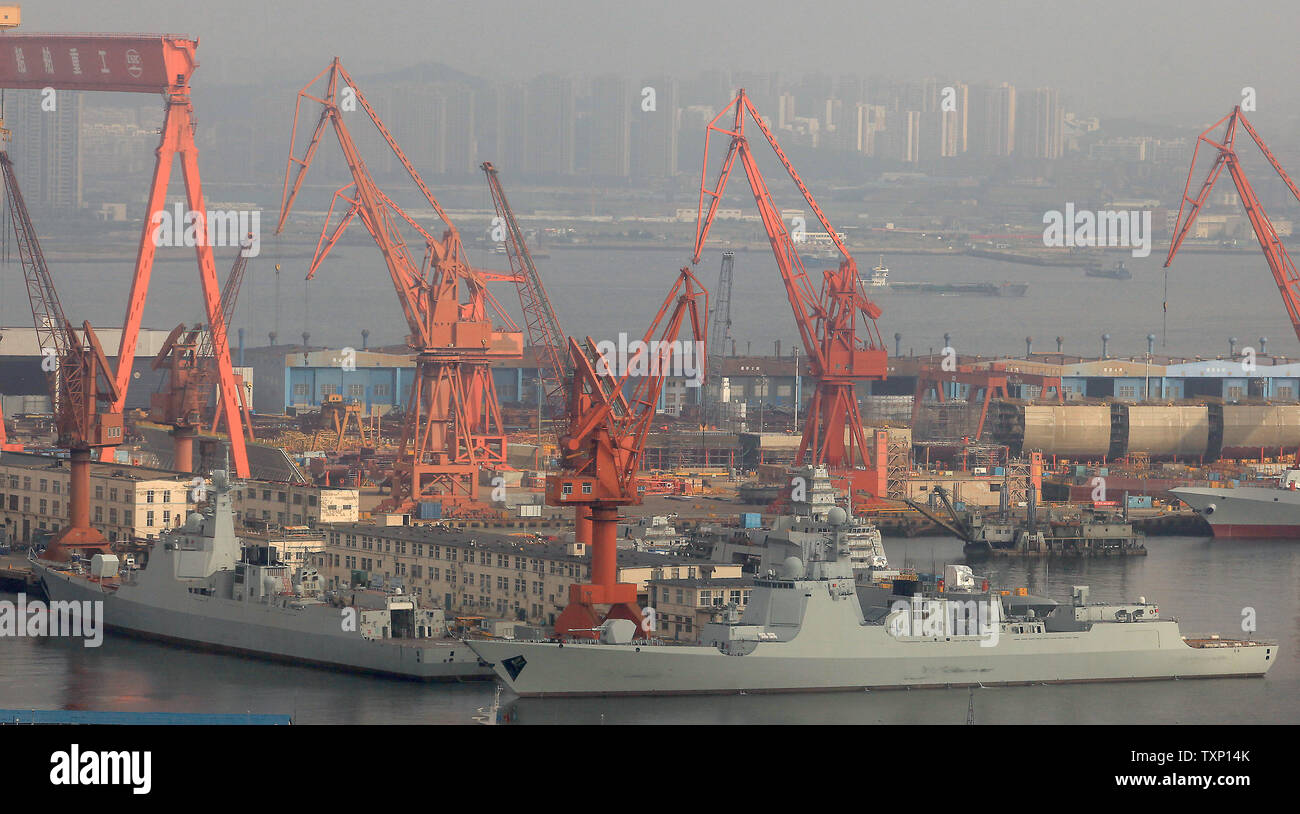 Chinese naval ships going through various stages of construction and ...