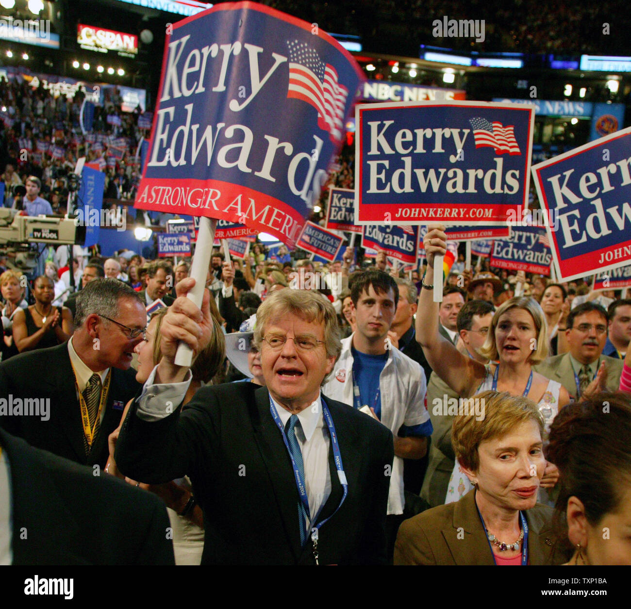 Talk show host Jerry Springer holds up a Kerry Edwards sign in the Ohio ...