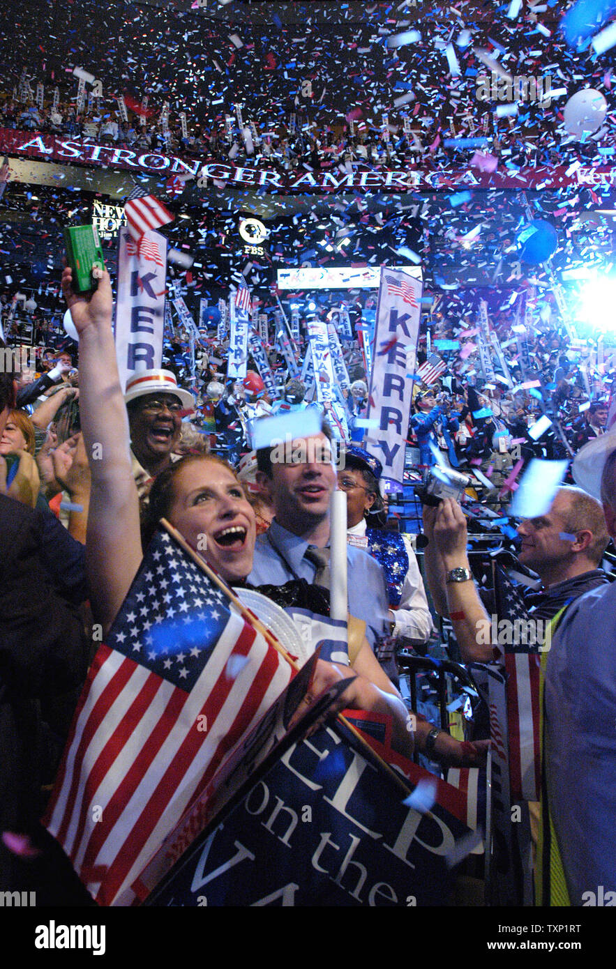 Delegates chear as tens of thousands of balloons float to the ground ...