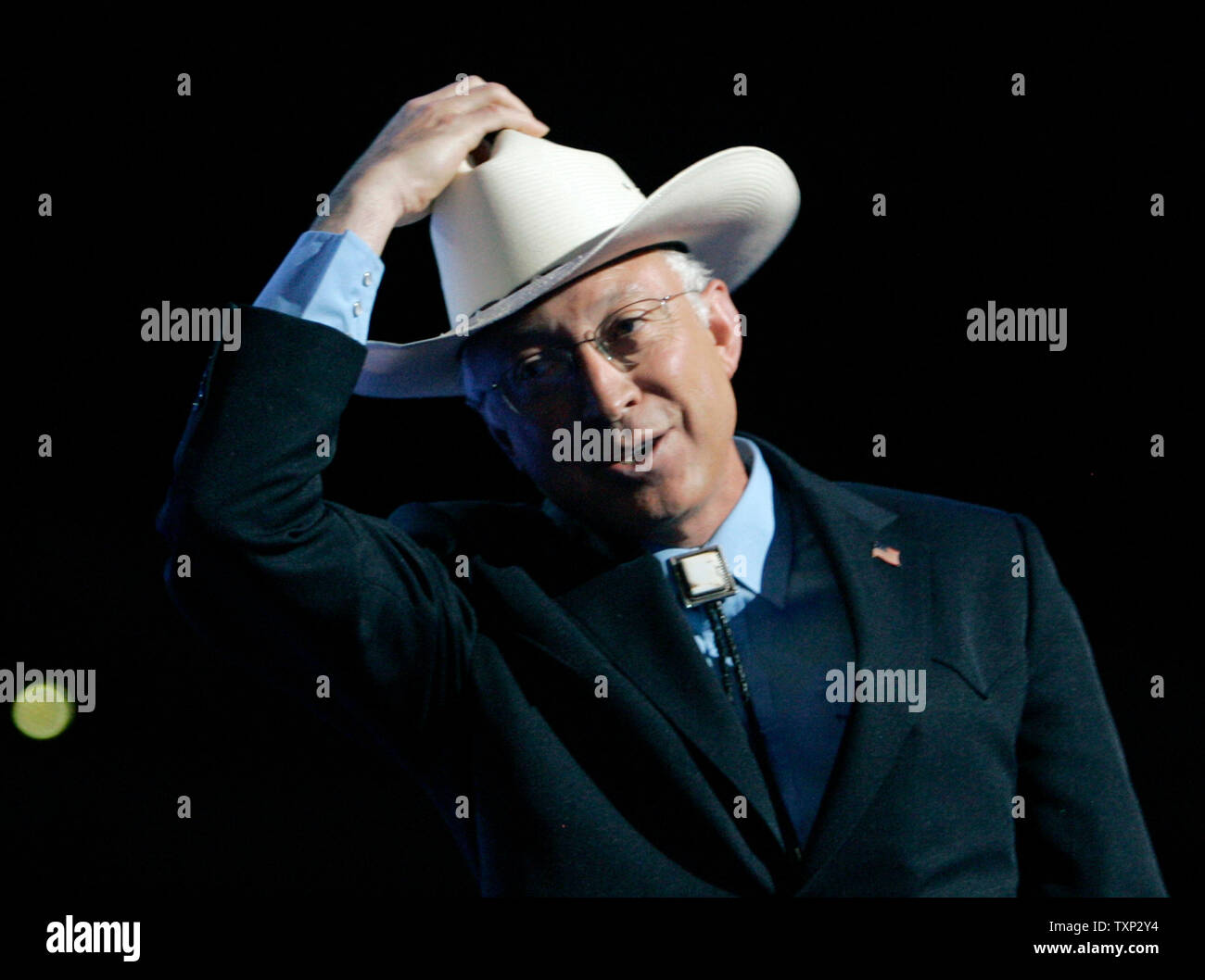 Sen. Ken Salazar (D-CO) lifts his hat to the audience as he departs ...