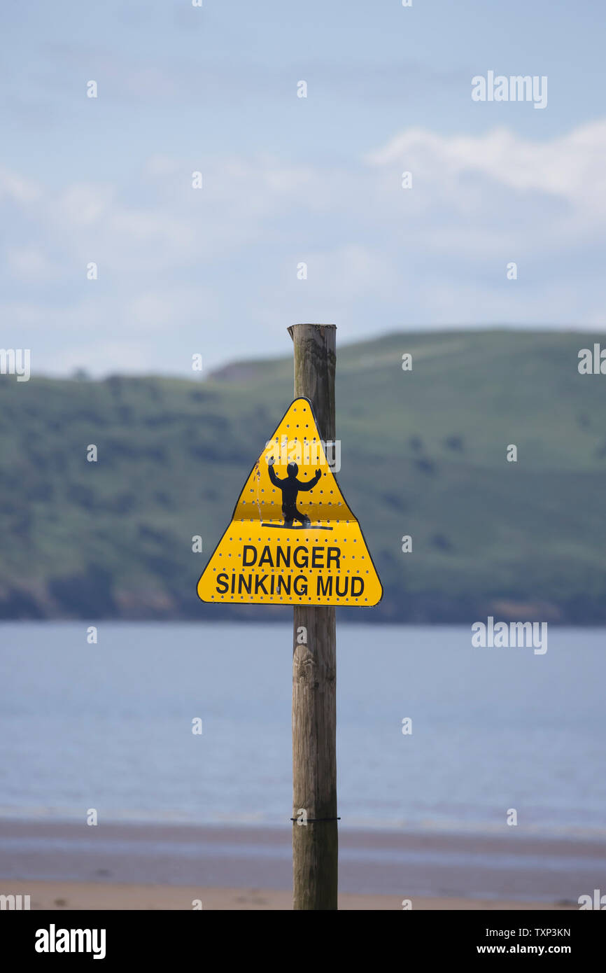 Yellow, triangle warning sign on UK beach: "Danger Sinking Mud" Weston ...