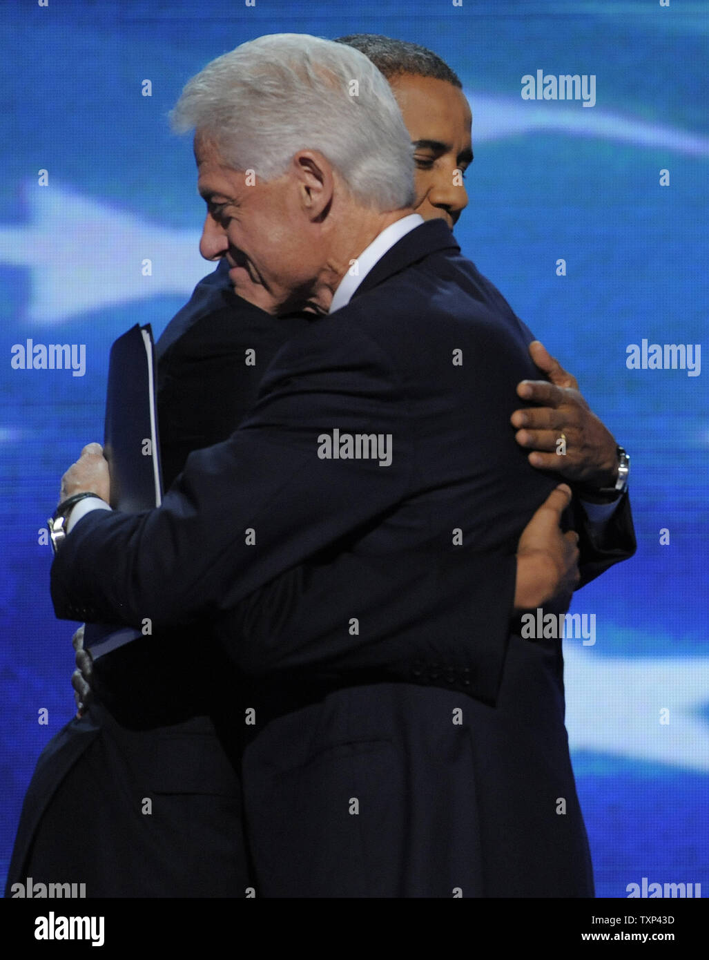 President Barack Obama hugs former President Bill Clinton after Clinton ...