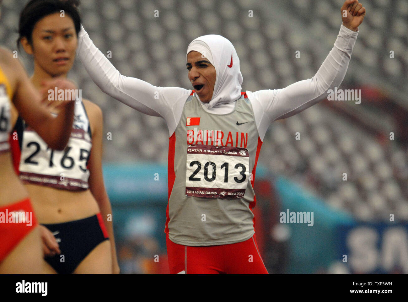 Bahrain's Ruqaya al Ghasara (left) wins the gold medal in the women's ...