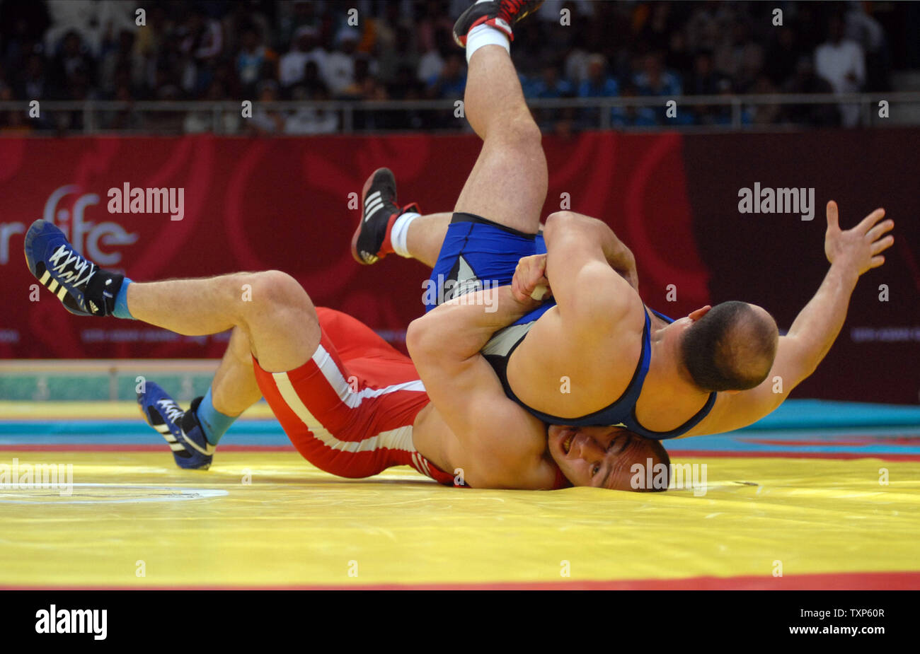 Uzbekistan's Artur Taymazov (L) spars and wins the gold medal in the ...