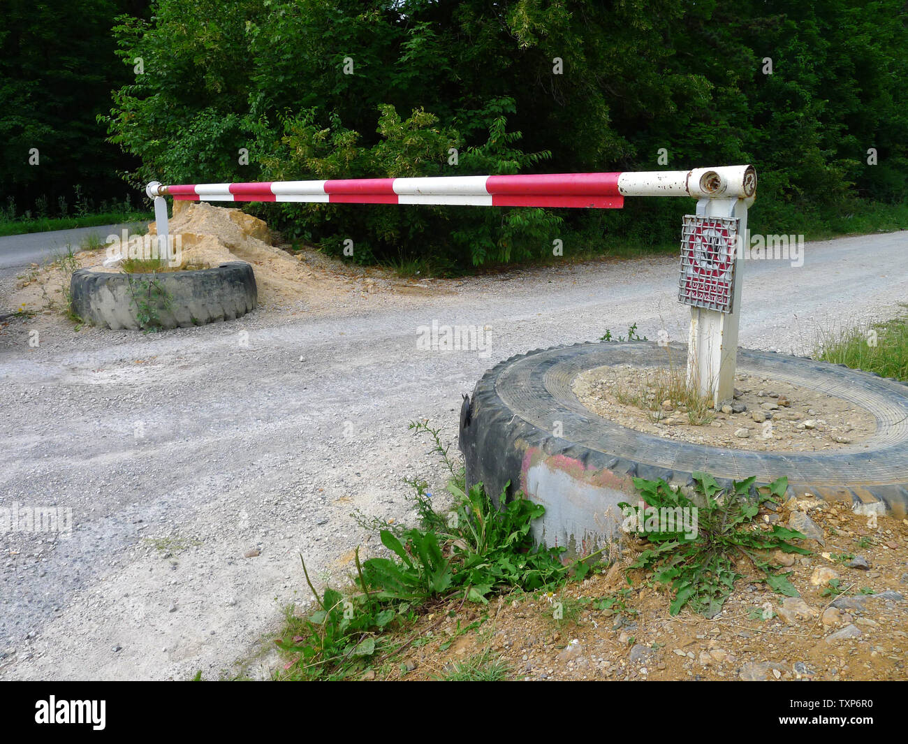 Red and white barrier across the road Stock Photo - Alamy