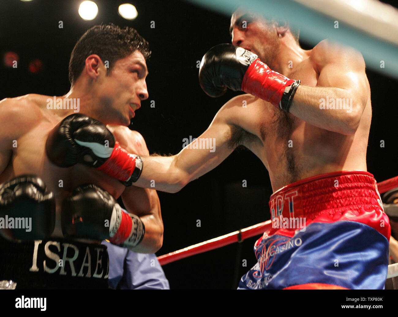 World Jr. Featherweight champion Israel Vazquez (left) of Mexico City ...