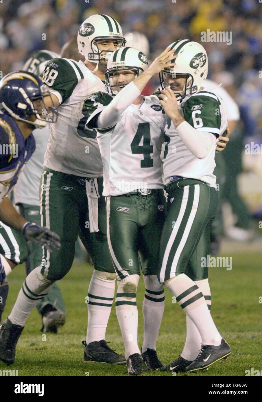New York Jets Toby Gowin (4) congratulates kicker Doug Brien (6) after ...