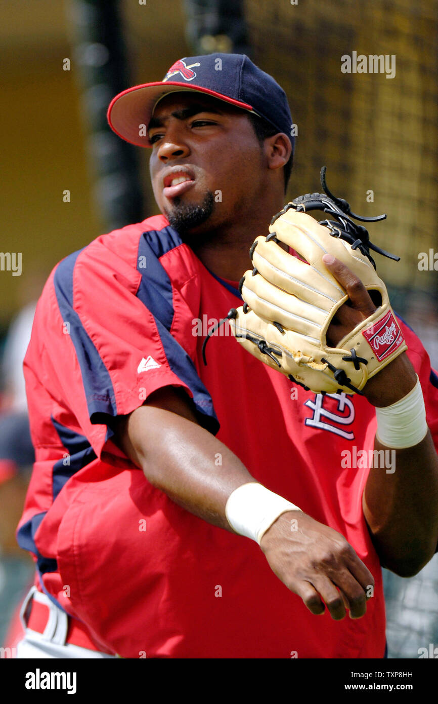 St. Louis Cardinals infielder Hector Luna loosens up his throwing arm ...