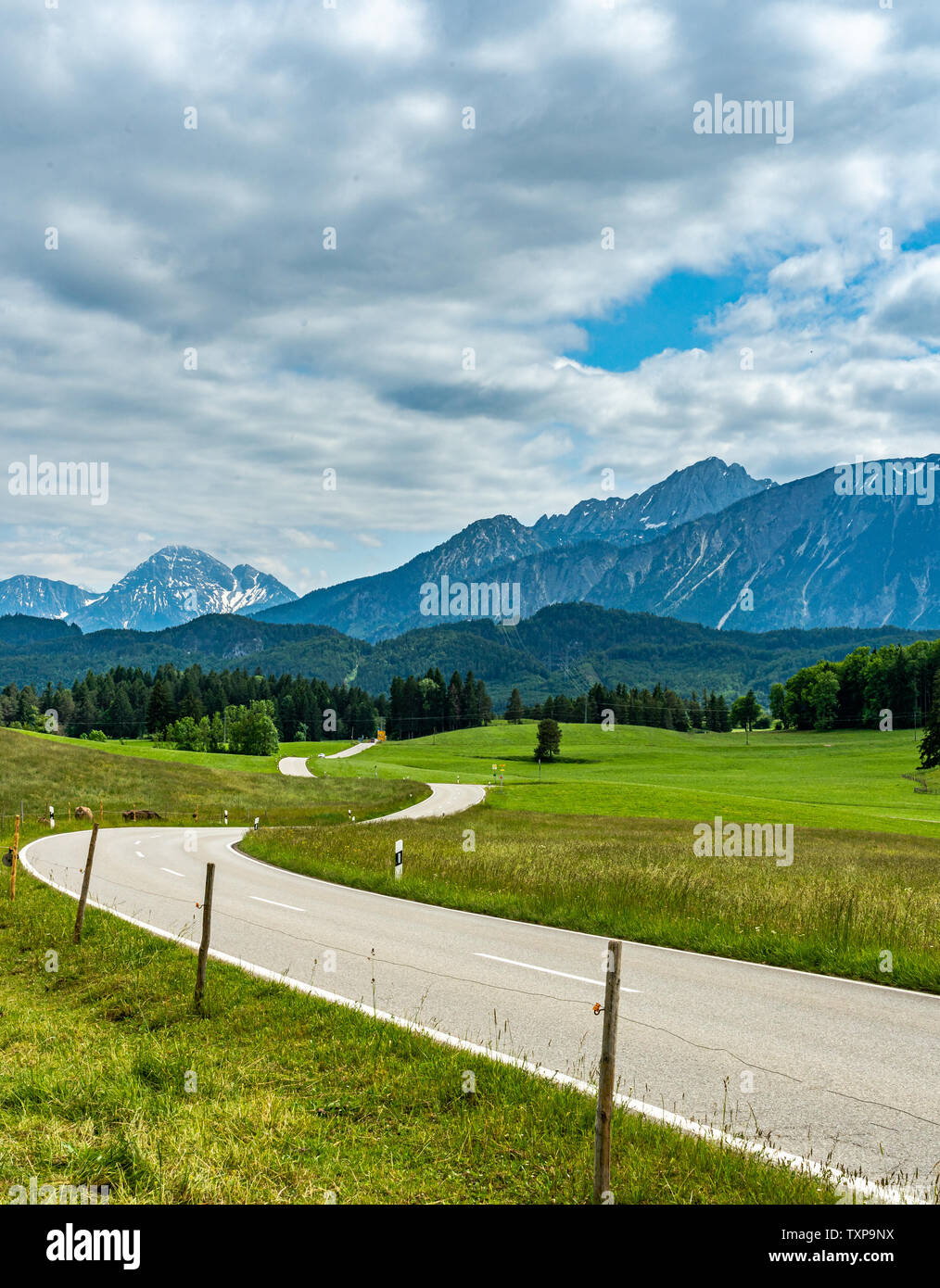 view on a street that leads to the bavarian alps, germany Stock Photo ...