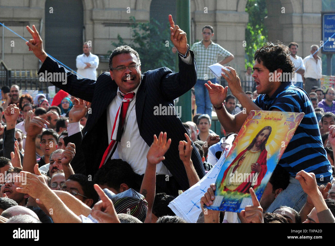 Angry Egyptian Christians shout slogans during a demonstration outside ...
