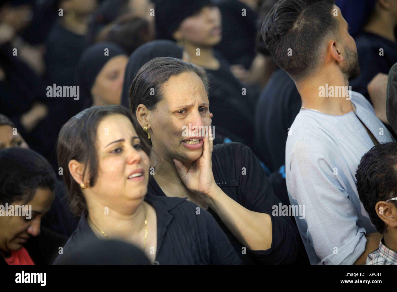 Relatives of killed Coptic Christians grieve during their funeral at ...