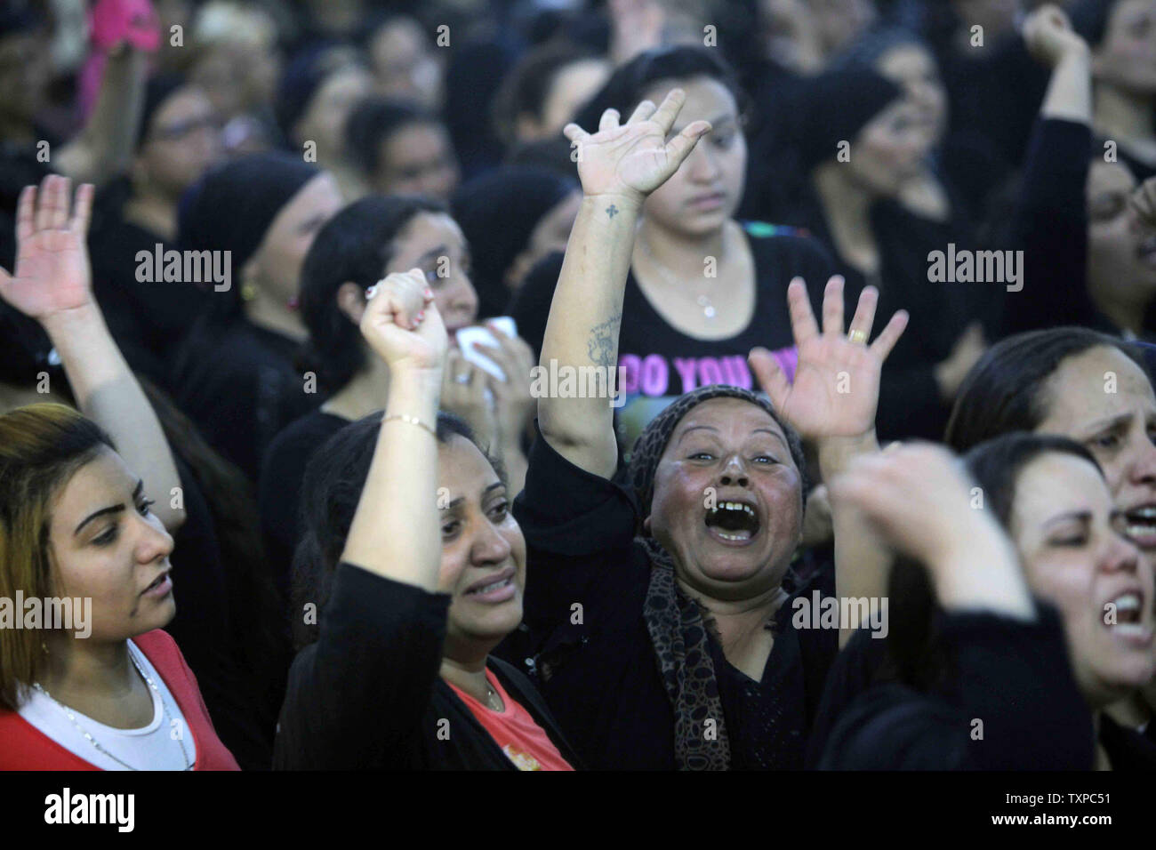 Relatives of killed Coptic Christians grieve during their funeral at ...