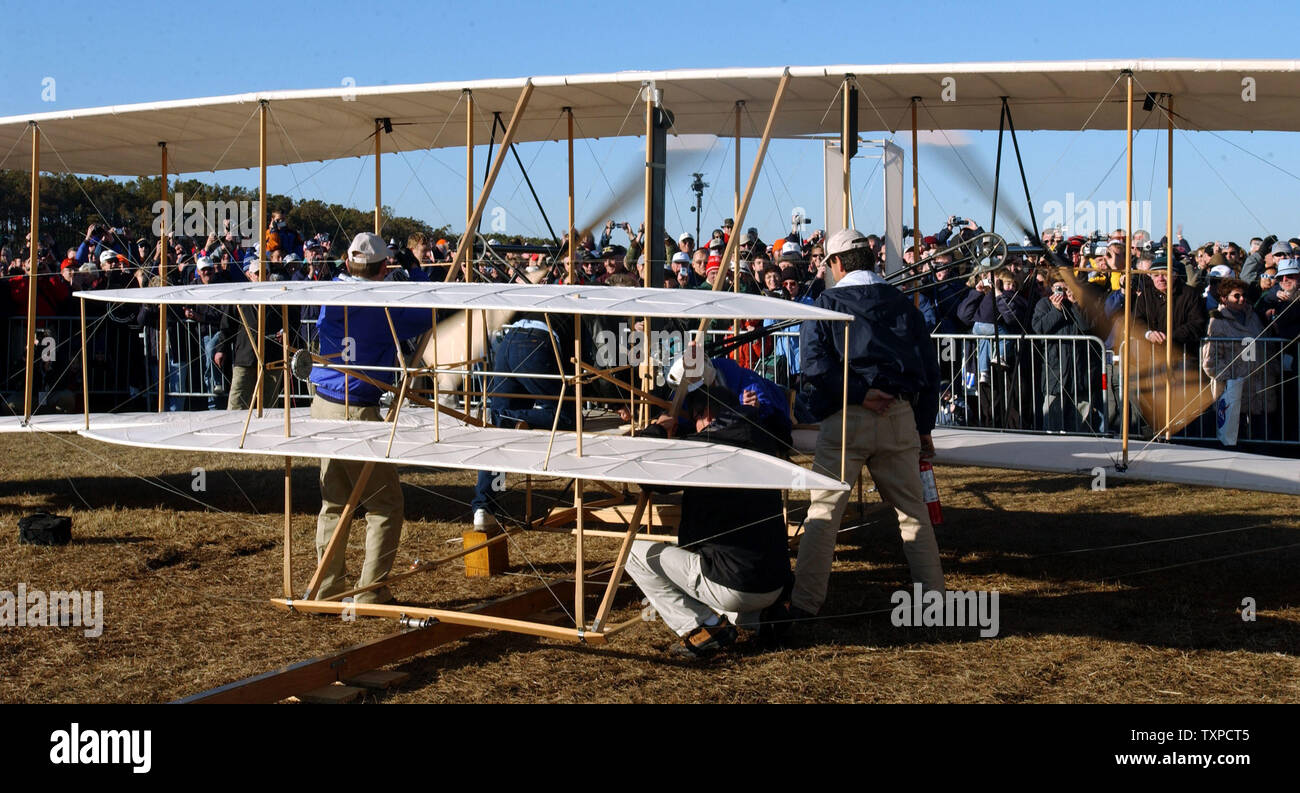 Members of the Wright Experience test the engine of the replica of the ...