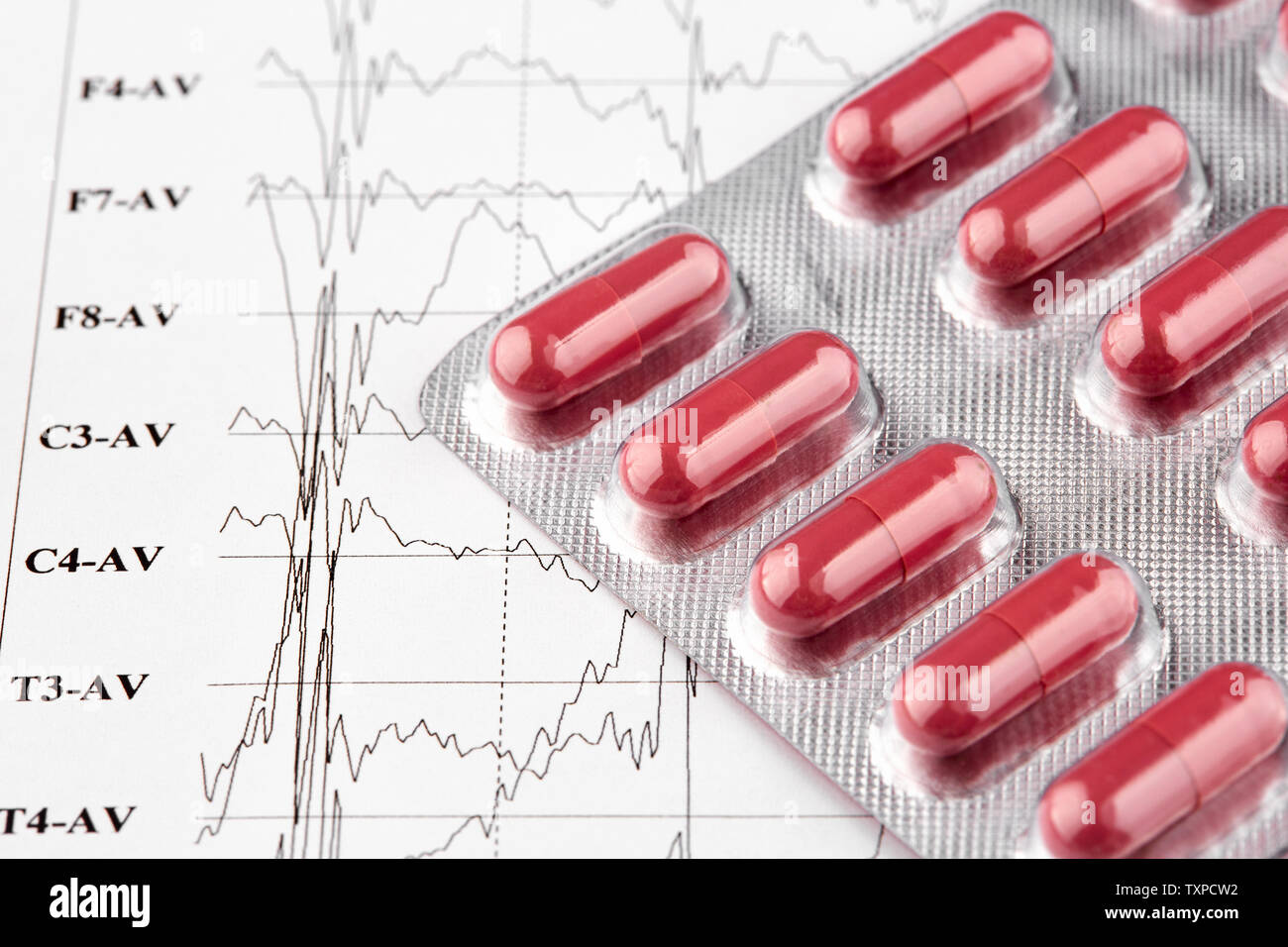 Blister with red pills on EKG graph. Medicine Stock Photo - Alamy
