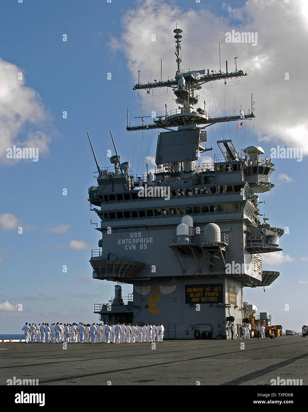 Navy personnel turnout for morning roll call on April 26 on the deck of ...