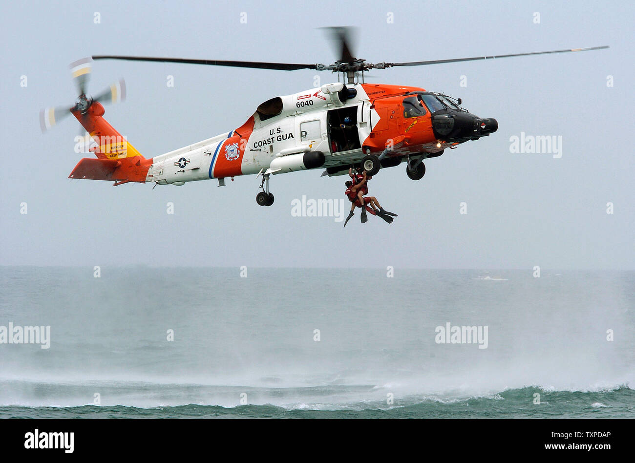 A US Coast Guard helicopter demonstrates an ocean rescue off of the ...