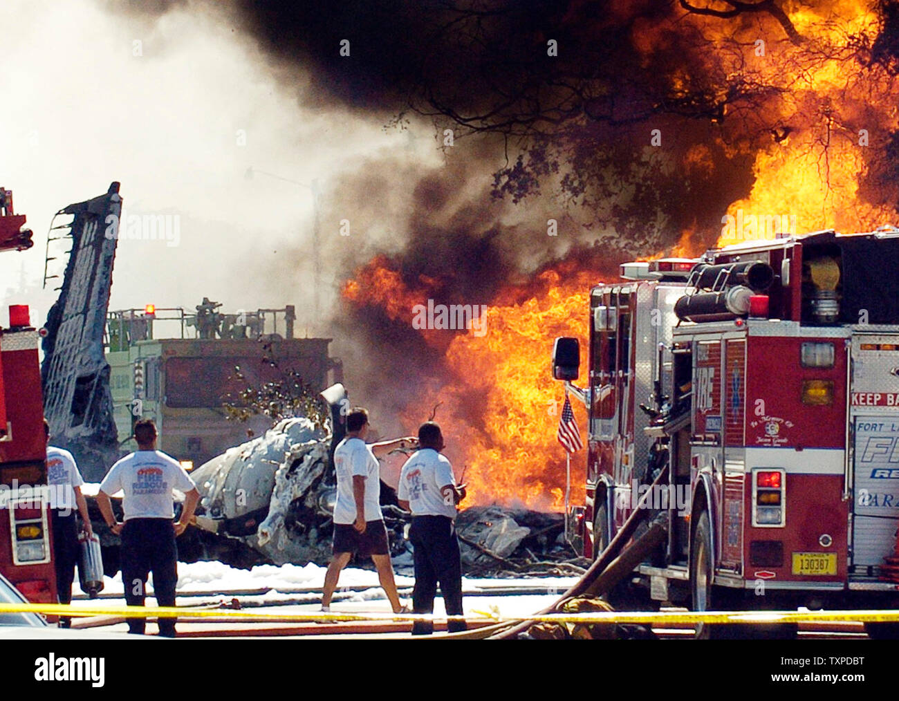 Flames leap from a chartered cargo DC 3 crash in a residential area of ...