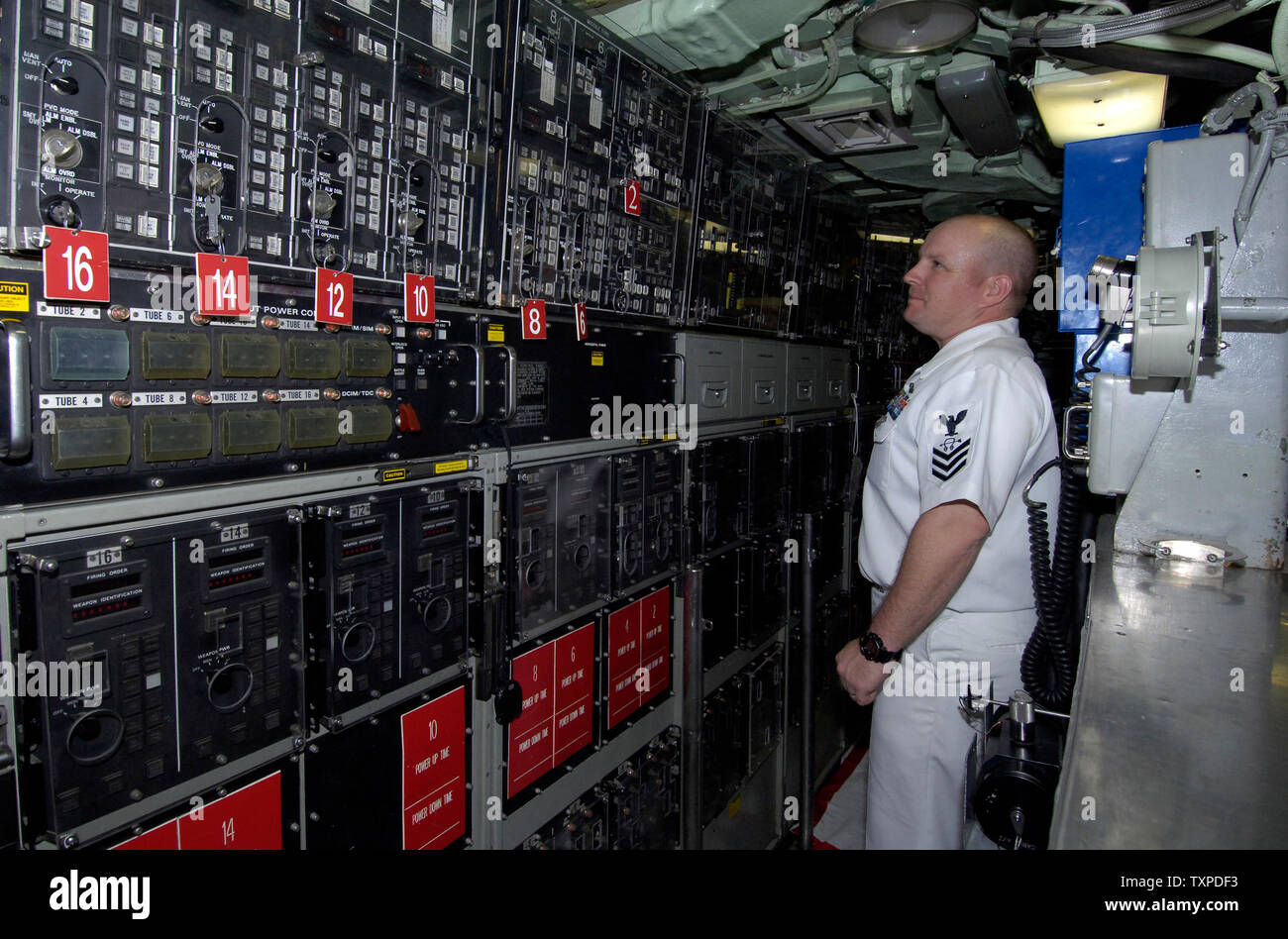 CS 3 Charles McMillan of the fast attack submarine USS Hampton explains ...