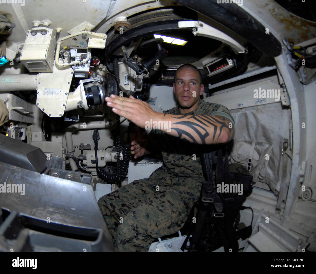USMC Corporal Robert Sowinski demonstrates the interior function of the ...