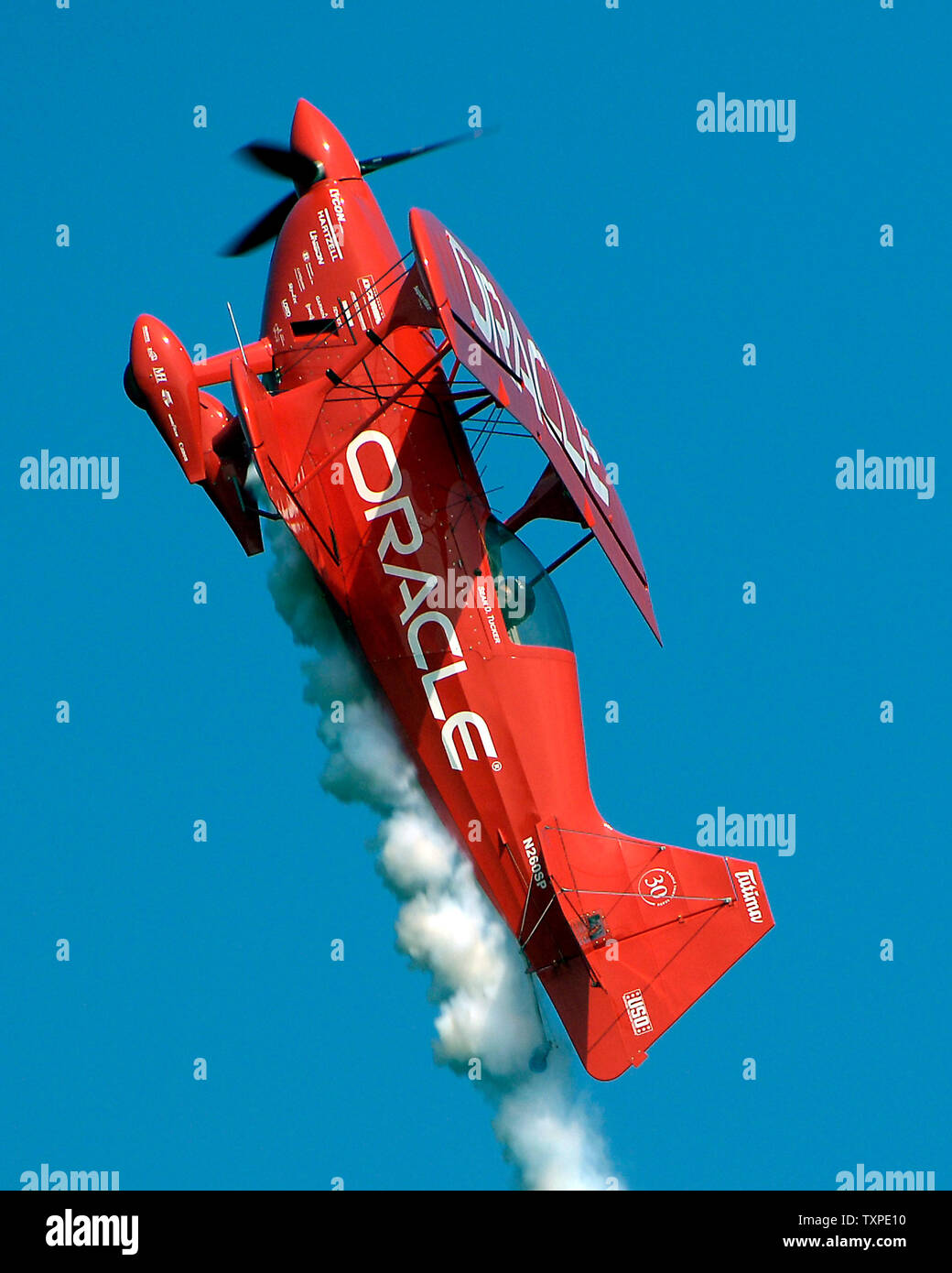 Aerobat Sean Tucker performs aerial maneuvers in his new Oracle ...