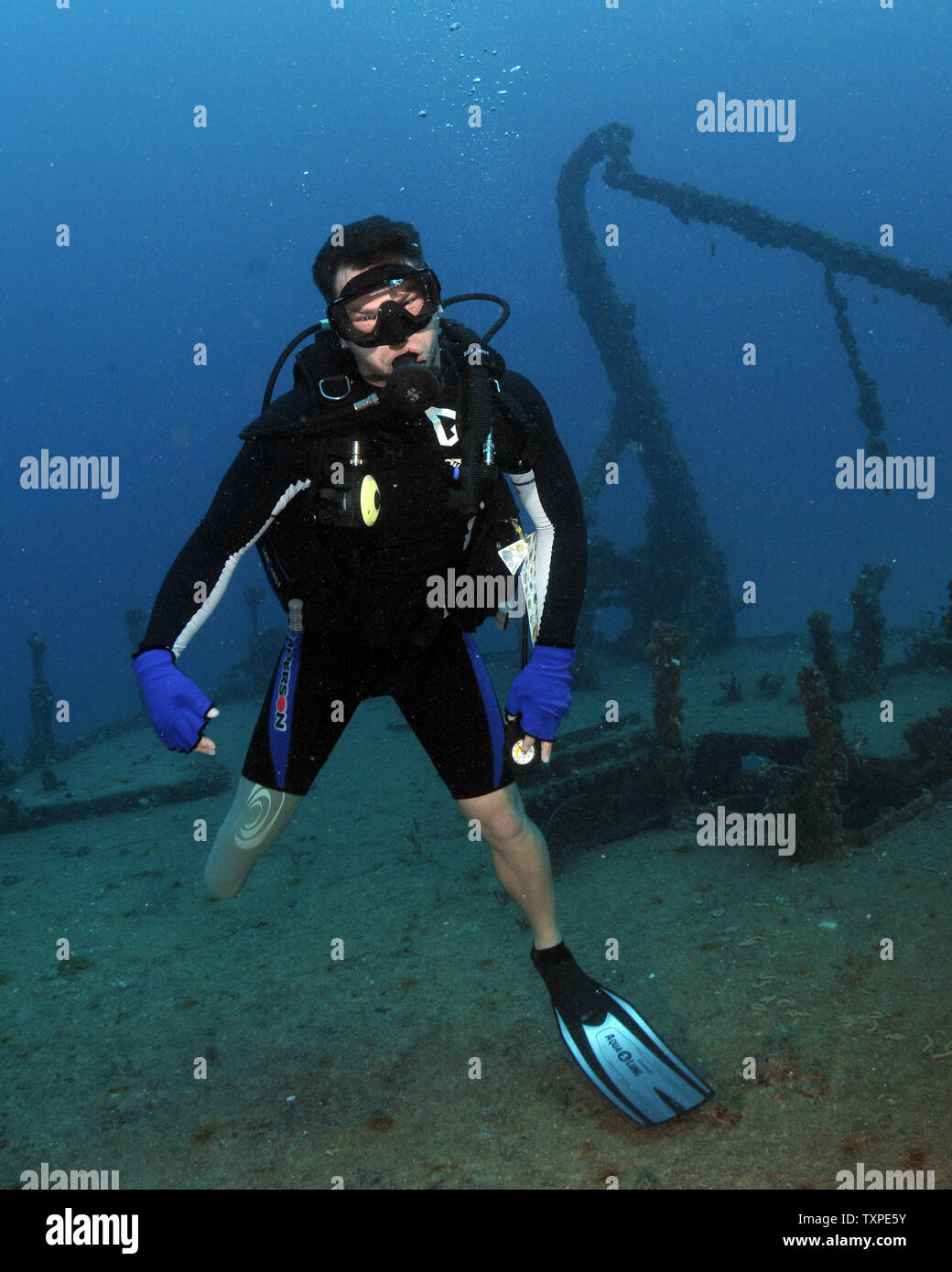 US Marine, Lance Corporal Tim Lang hovers over the Captain Dan Wreck ...