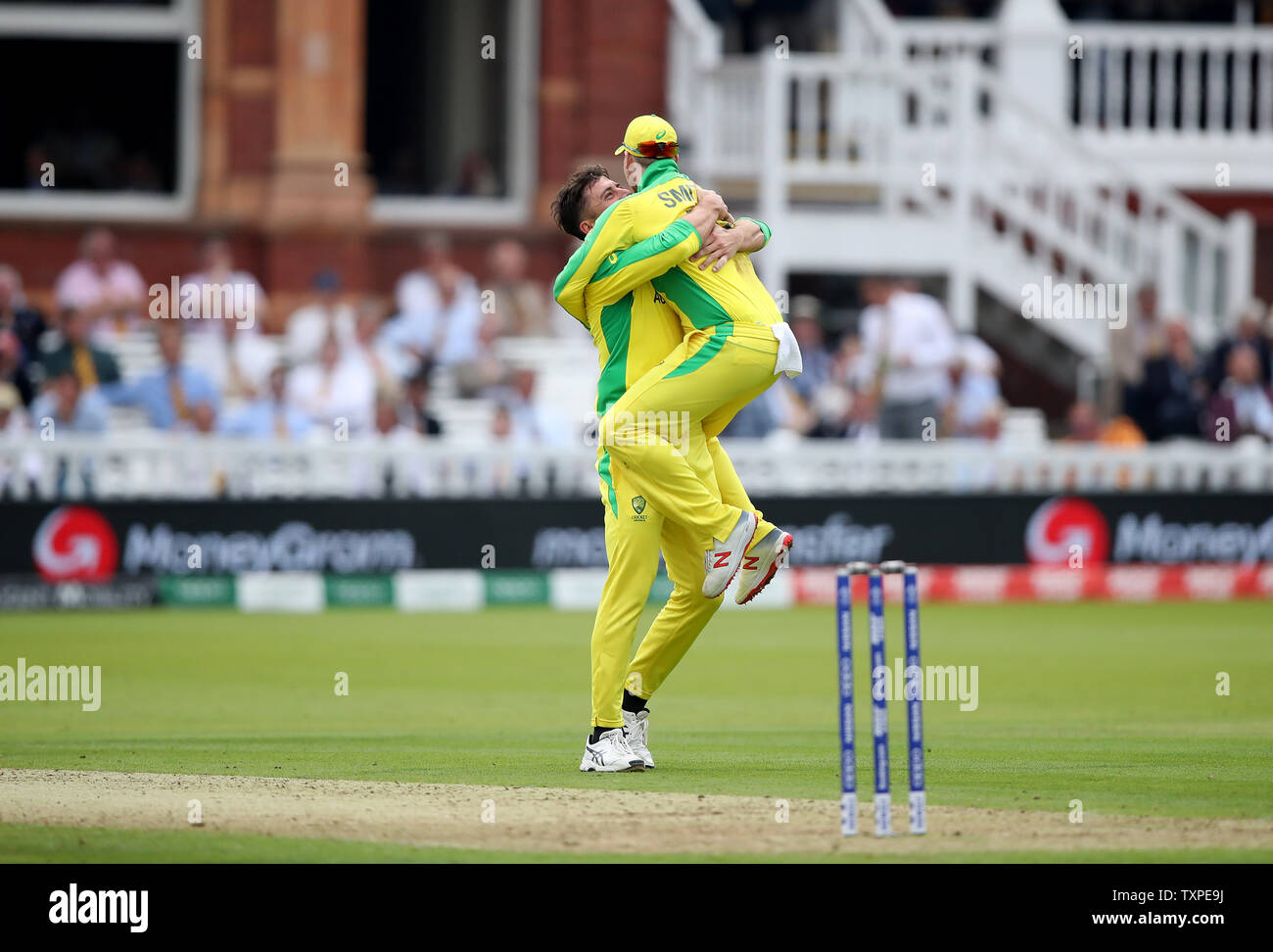 Australia's Marcus Stoinis (left) celebrates taking the wicket of ...