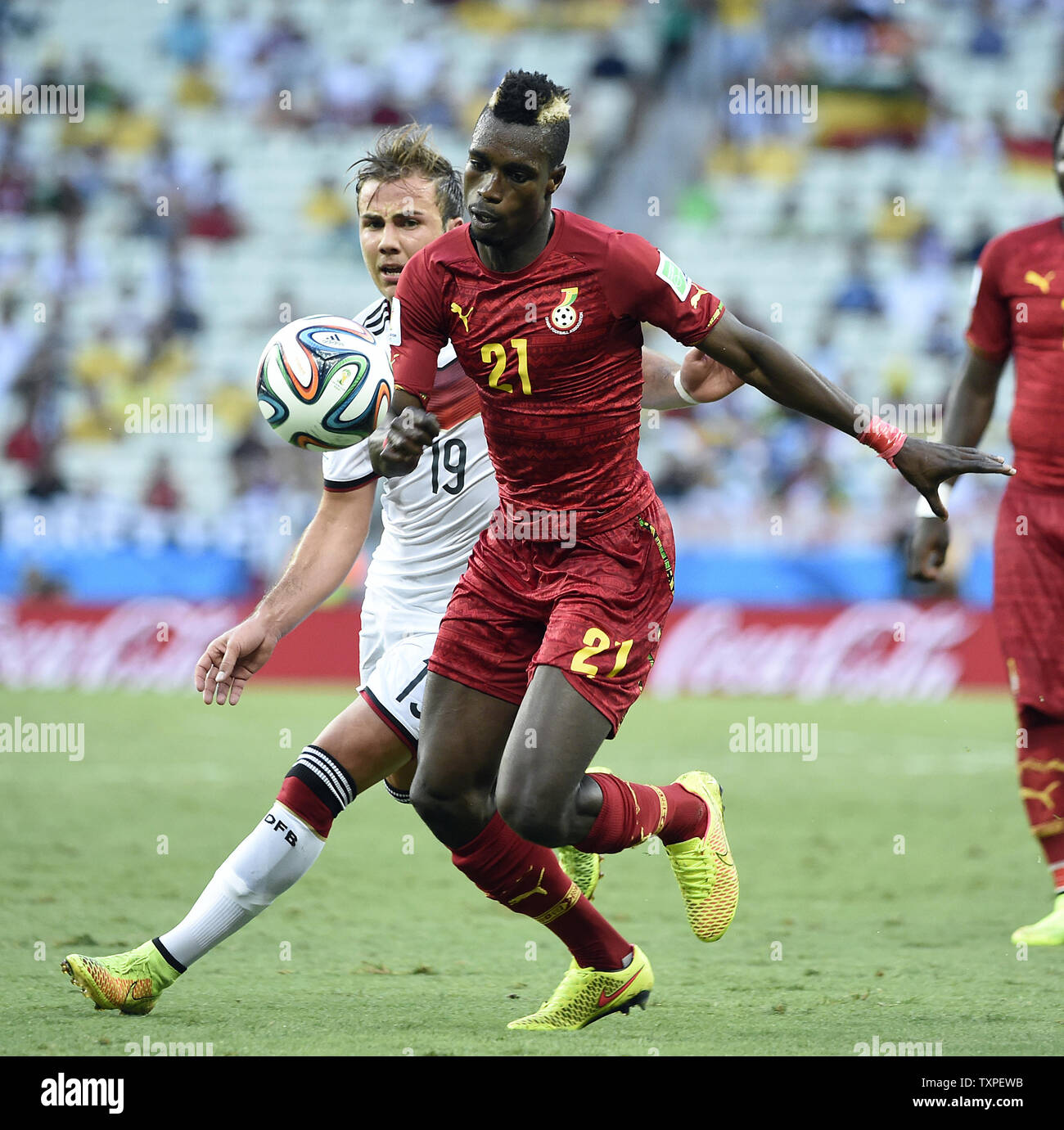 Mario Gotze of Germany (L) competes with John Boye of Ghana during the ...