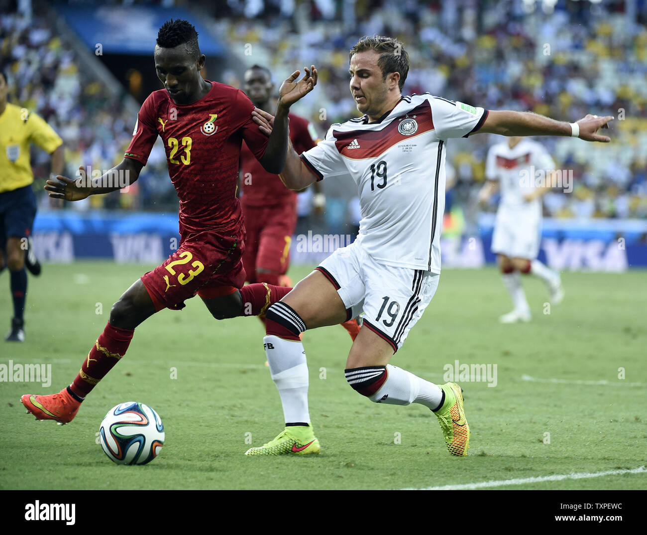 Mario Gotze of Germany competes with Harrison Afful (L) of Ghana during ...