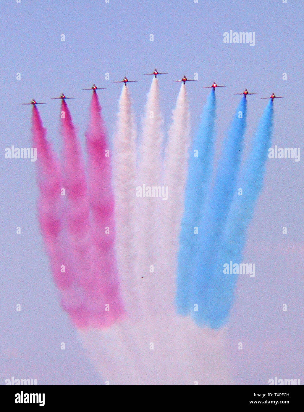 French military planes perform a colorful red-white-blue fly-by during ...