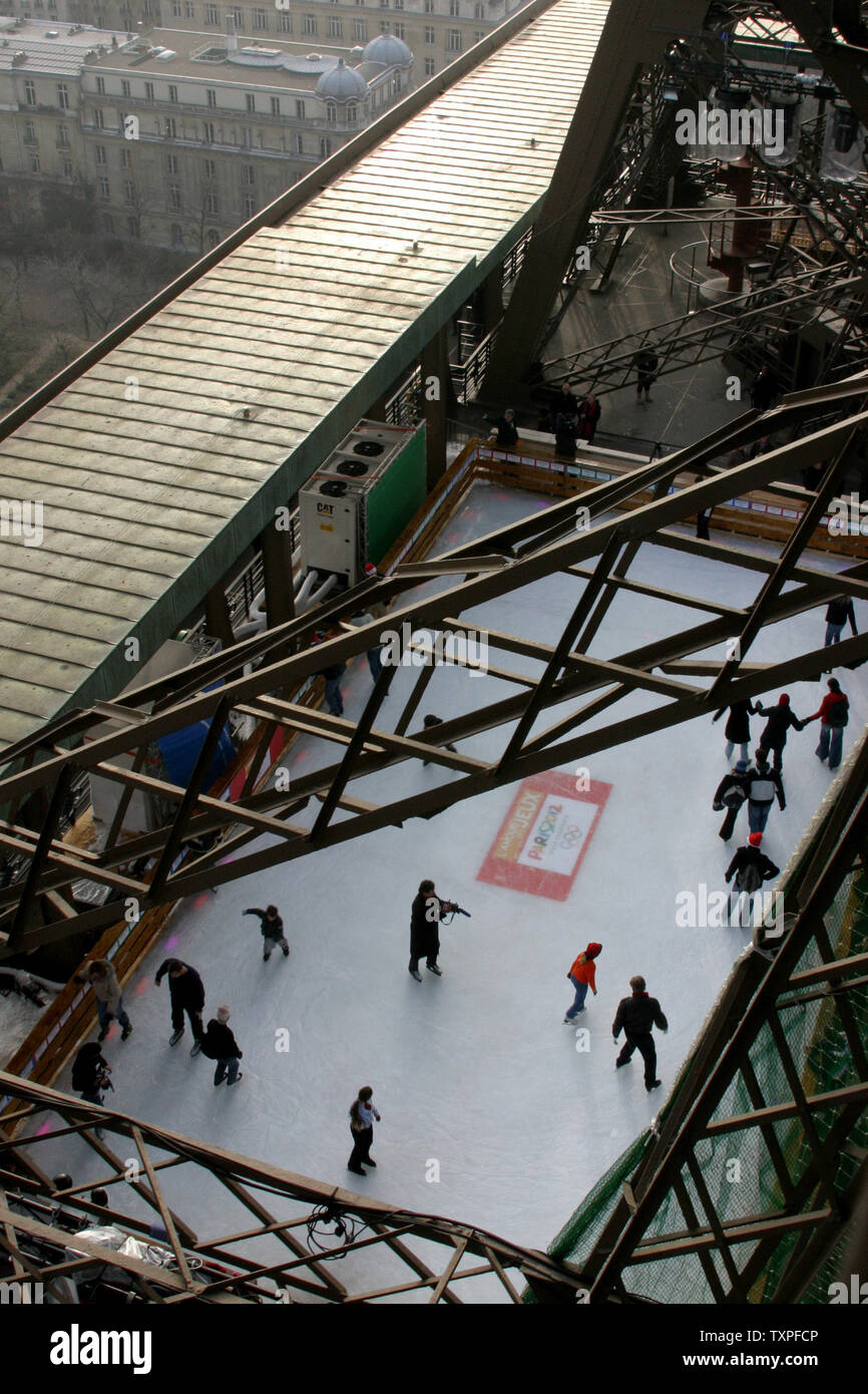 Parisiens and visitors ice skate at the opening of a new temporary rink ...