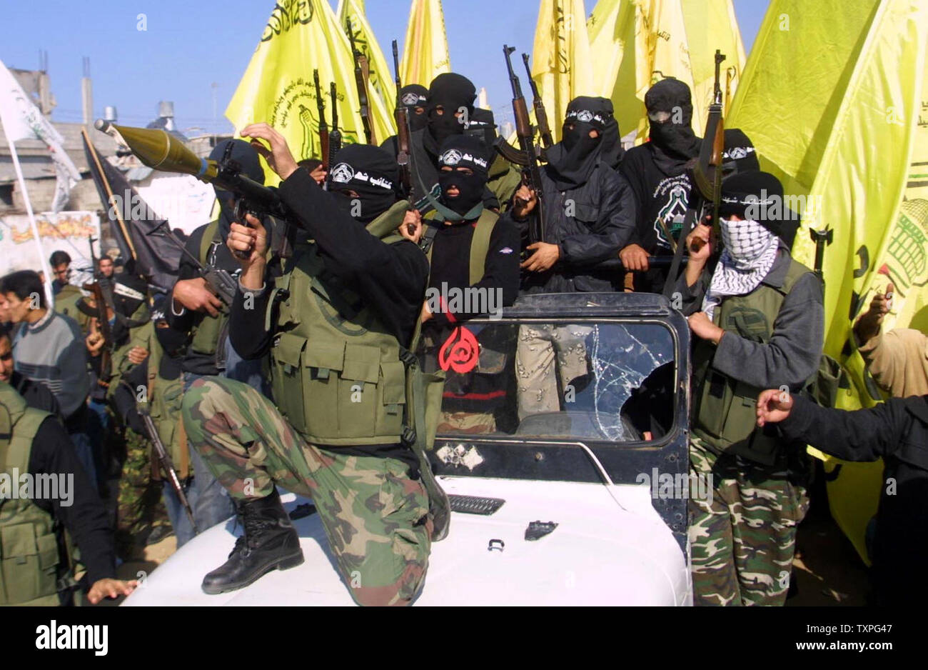 Palestinian masked militants from the Al Aqsa Martyrs Brigade, a group ...