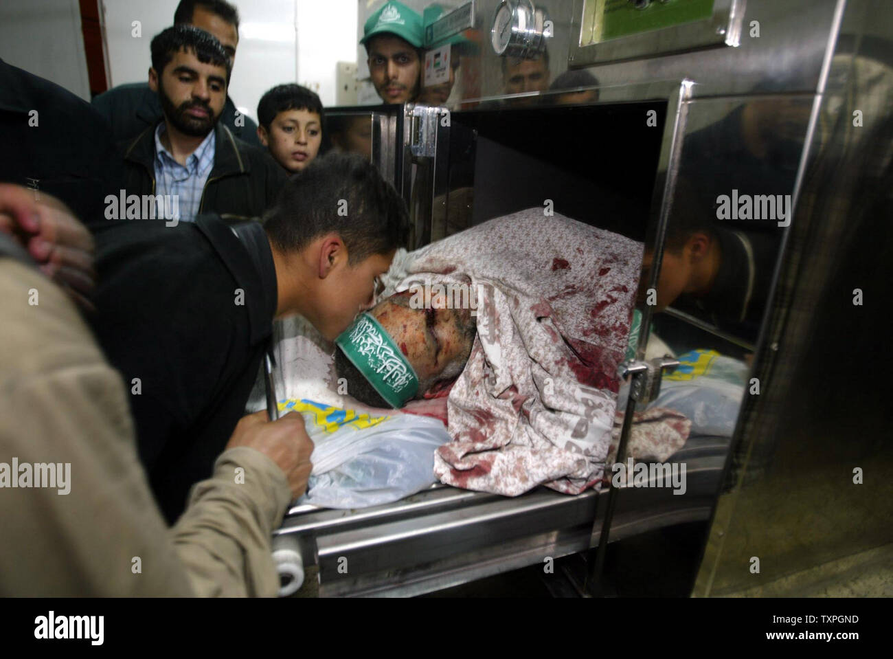 An unidentified man kisses the cheek of the leader of the Islamist ...