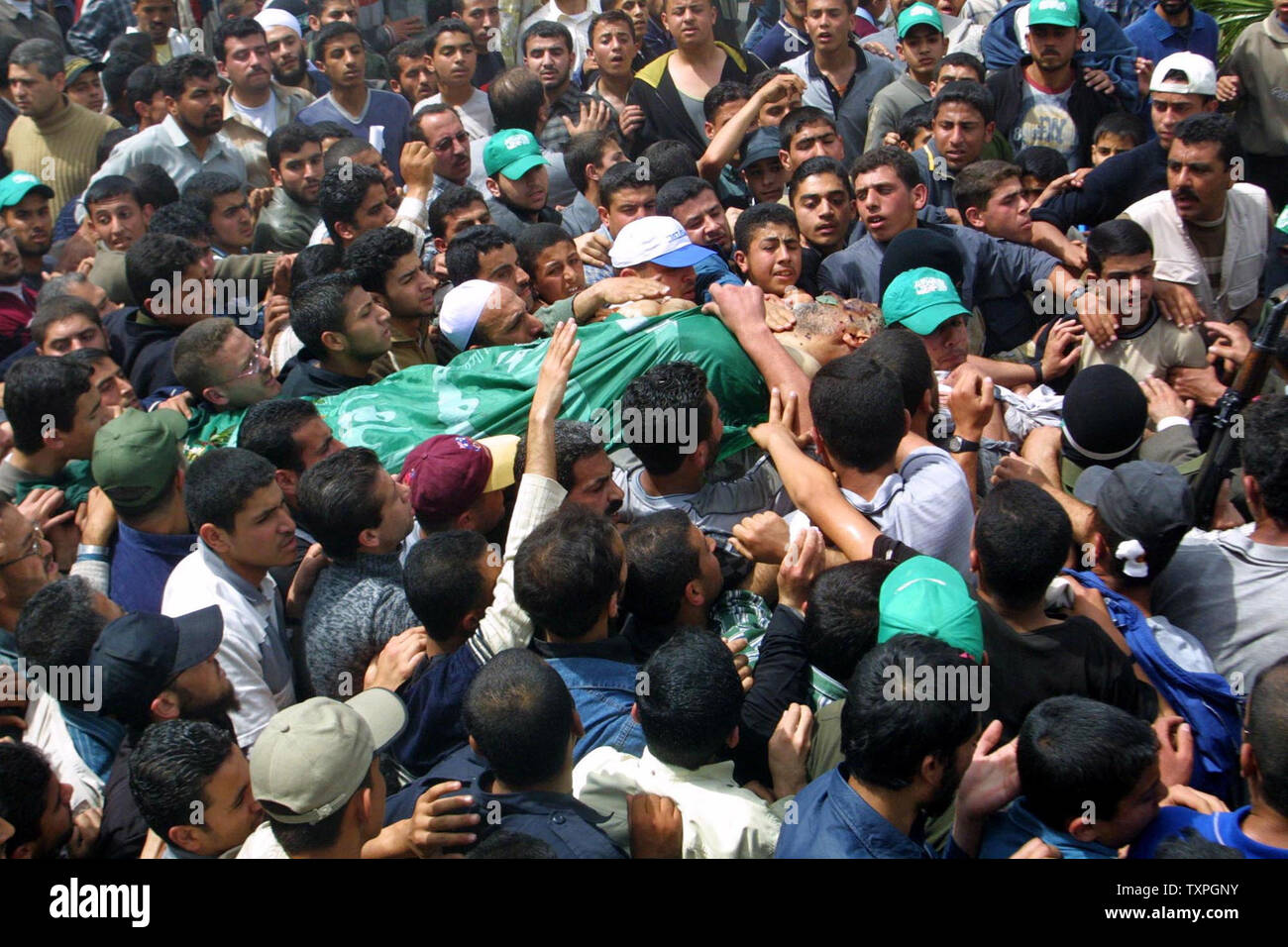 Palestinian mourners carry the body of the newly appointed leader of ...