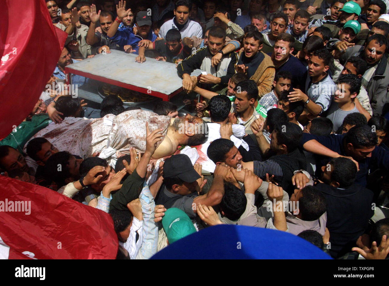 Palestinian mourners carry the body of the newly appointed leader of ...