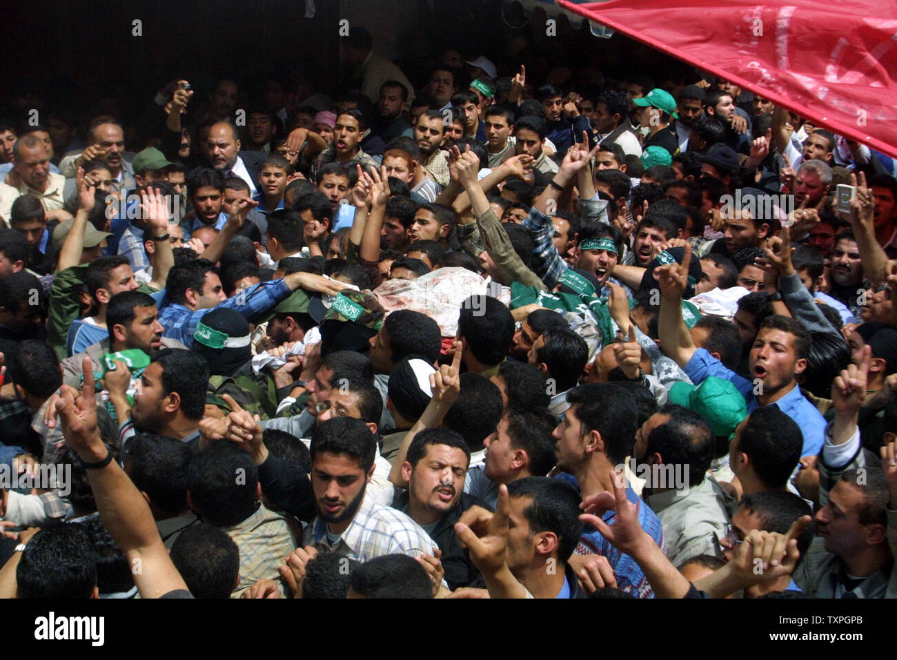 Palestinian mourners carry the body of the newly appointed leader of ...